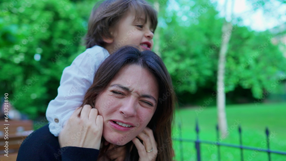 Careless small boy choking mom while playing. Kid not knowing play ...