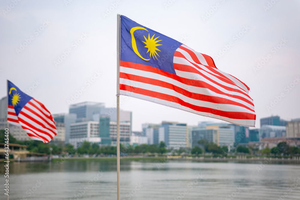 The Malaysia flag is also known as Jalur Gemilang waving with a city in ...