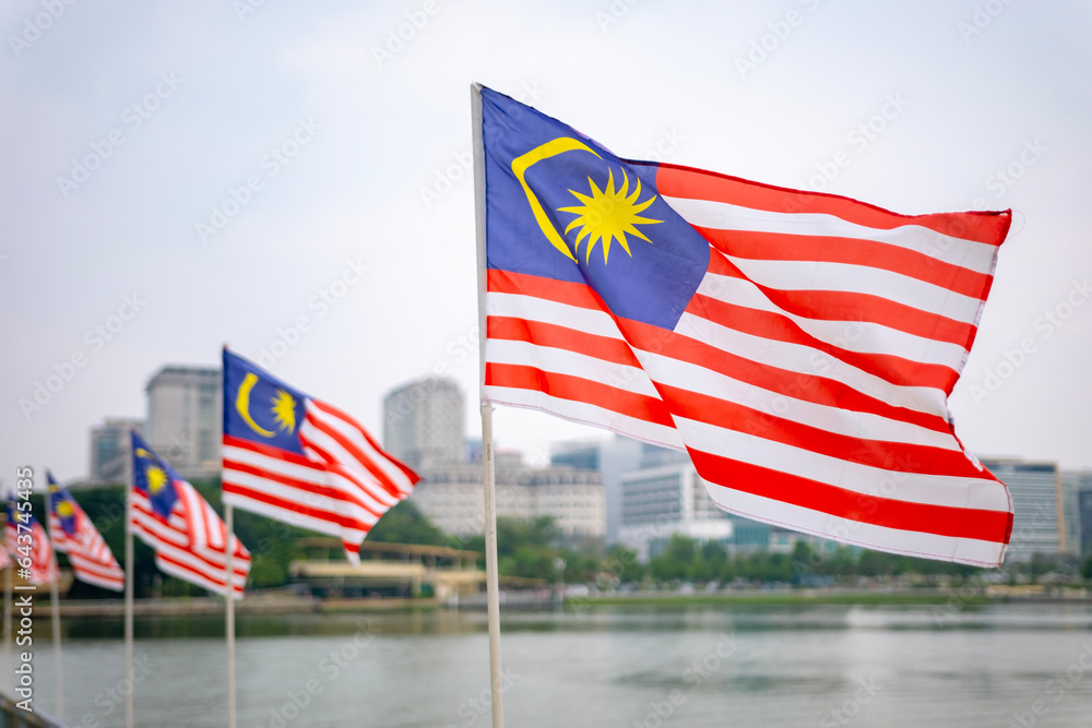 The Malaysia flag is also known as Jalur Gemilang waving with a city in ...