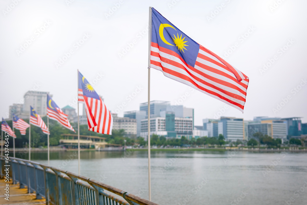 The Malaysia flag is also known as Jalur Gemilang waving with a city in ...