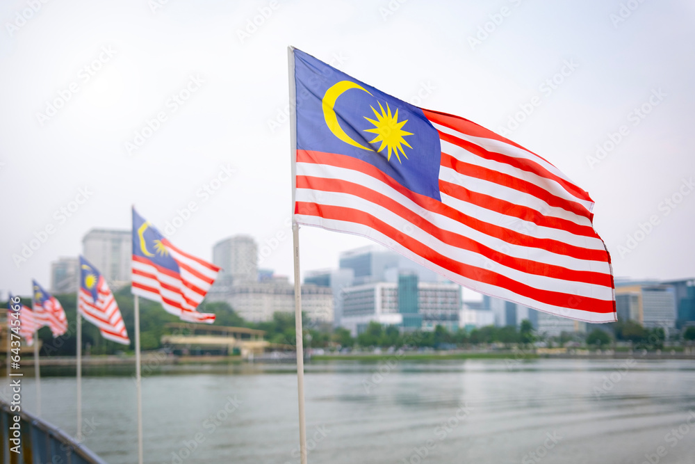 The Malaysia flag is also known as Jalur Gemilang waving with a city in ...