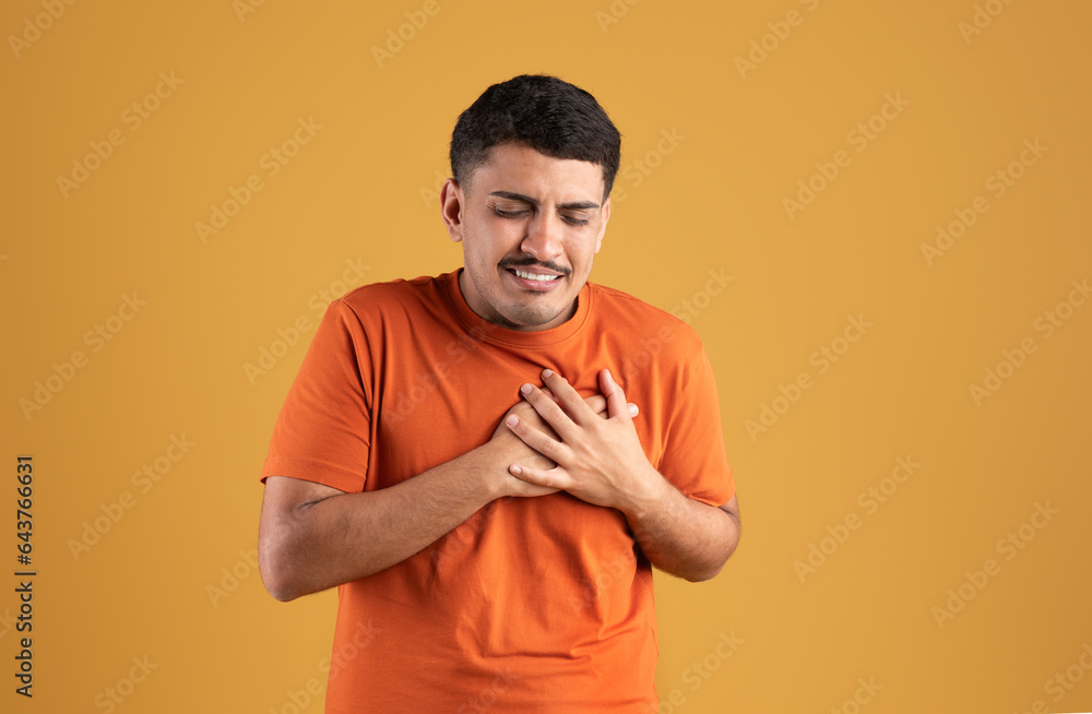 Scared brazilian man touching chest, feeling sudden acute pain, risk of ...