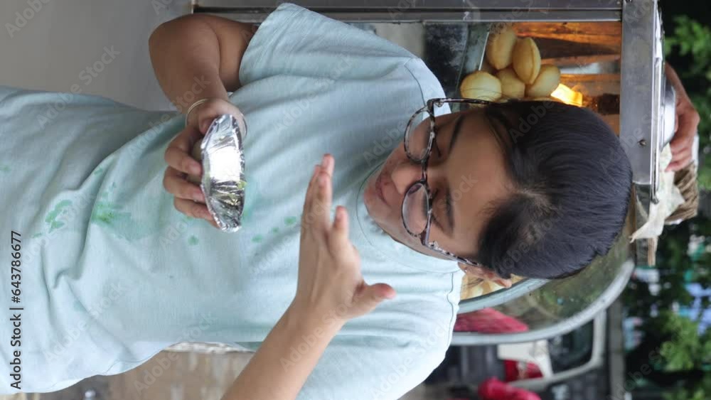 Happy Indian woman having North Indian subcontinent popular street food ...