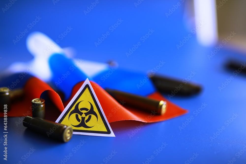 Russian flag and bullet casings on the table. Background concept ...