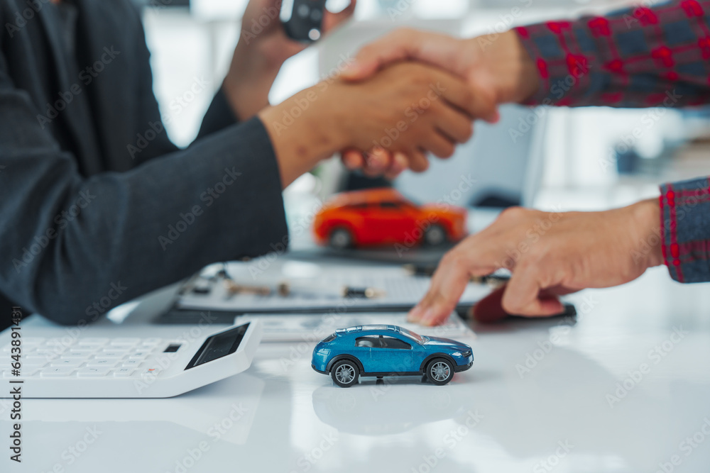Handshake, Businessman completes successful car purchase transaction by ...