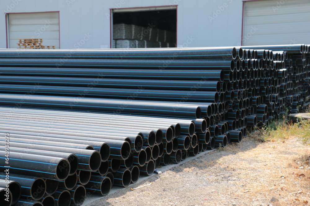 PE pipe plant, Industrial PE pipes with blue line for gas and water ...