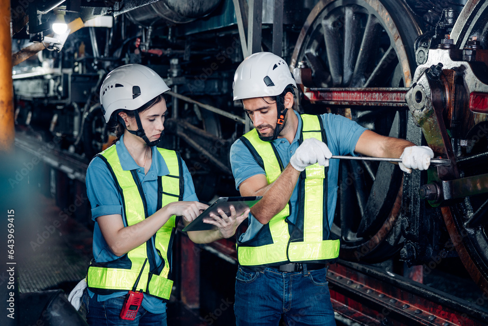 Team of engineer railway wearing safety uniform and helmet under ...