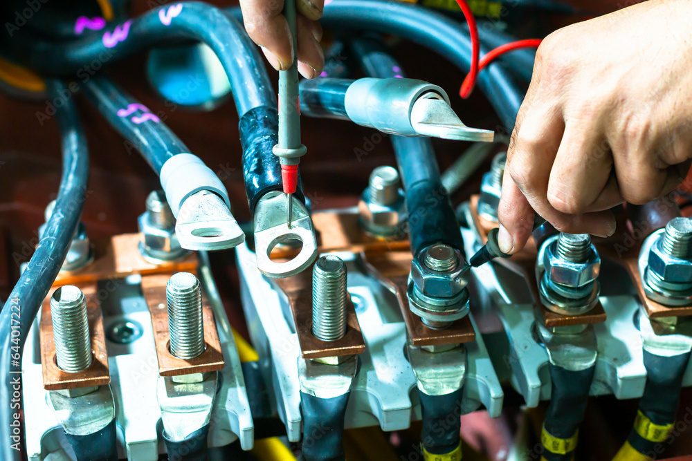 Engineer using measuring equipment tool checking electric current ...