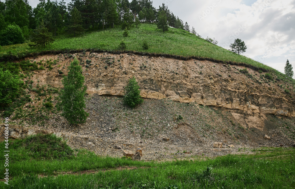 Layers of soil with groundwater. Details of earth layers in a clay pit ...