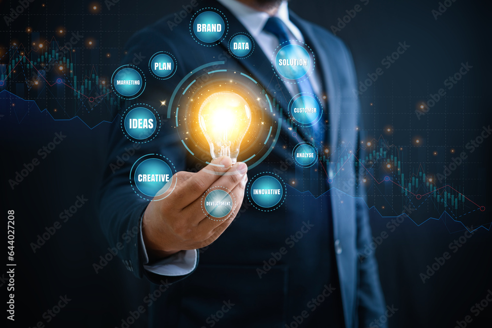 Businessman hand holding creative light bulb with icons brand data ...