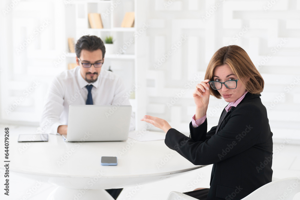 Shocked female office worker surprising because of her angry boss fired ...