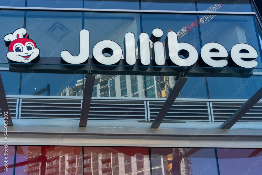 Close up of Jollibee restaurant sign on the building in Surrey, British ...