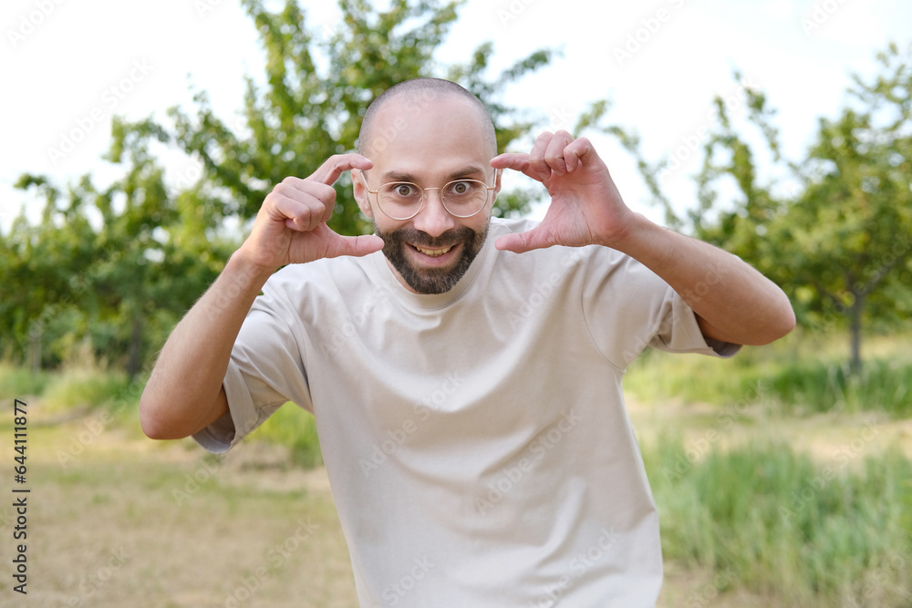 charismatic young bearded satisfied guy 30 years old looks, laughing ...