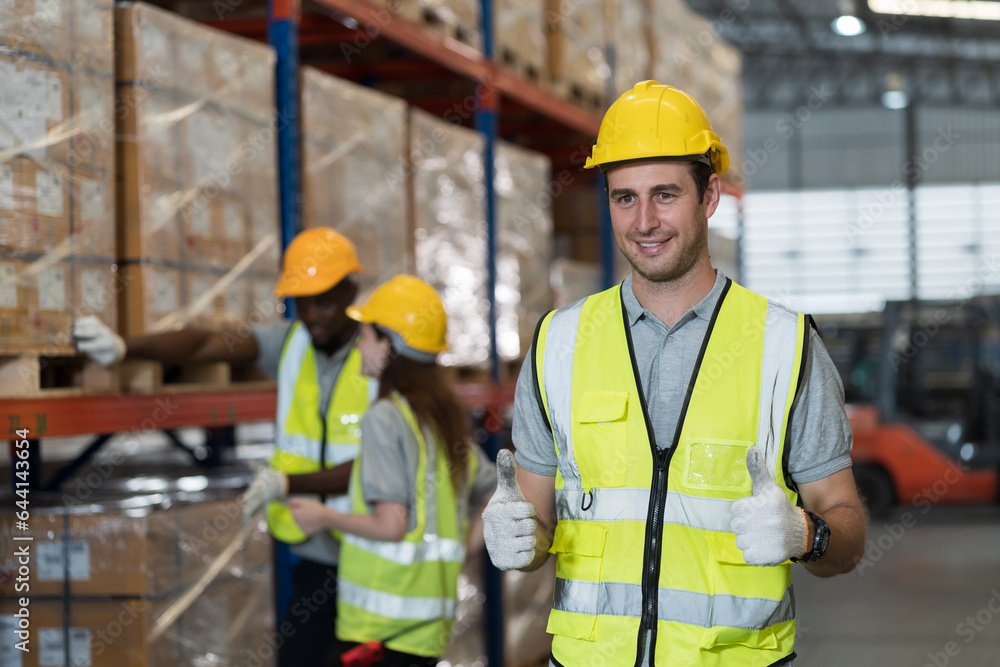 Portrait of male warehouse worker working and wearing safety uniform ...