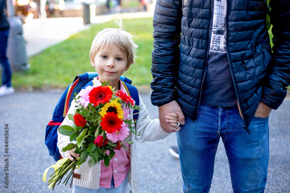 First day at school for a firstgraden, child starting school, bringing ...