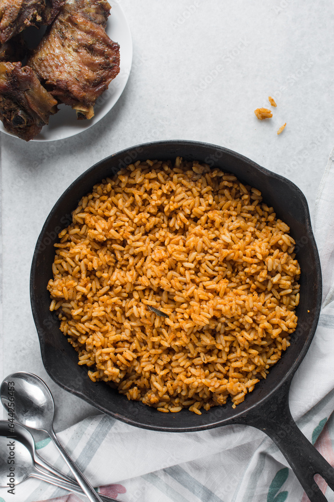 Jollof rice in a cast iron skillet, homemade party nigerian jollof rice ...