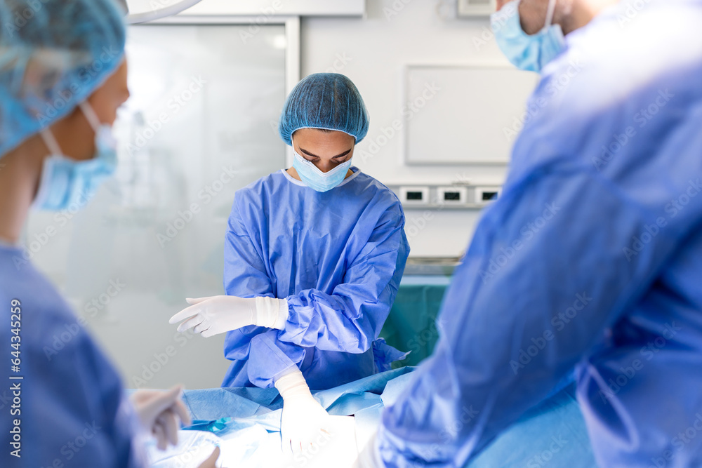 Professional surgeon holding forceps with suture thread. surgeon ...