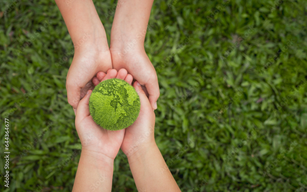 world environment day hand holding green globe on green background ...