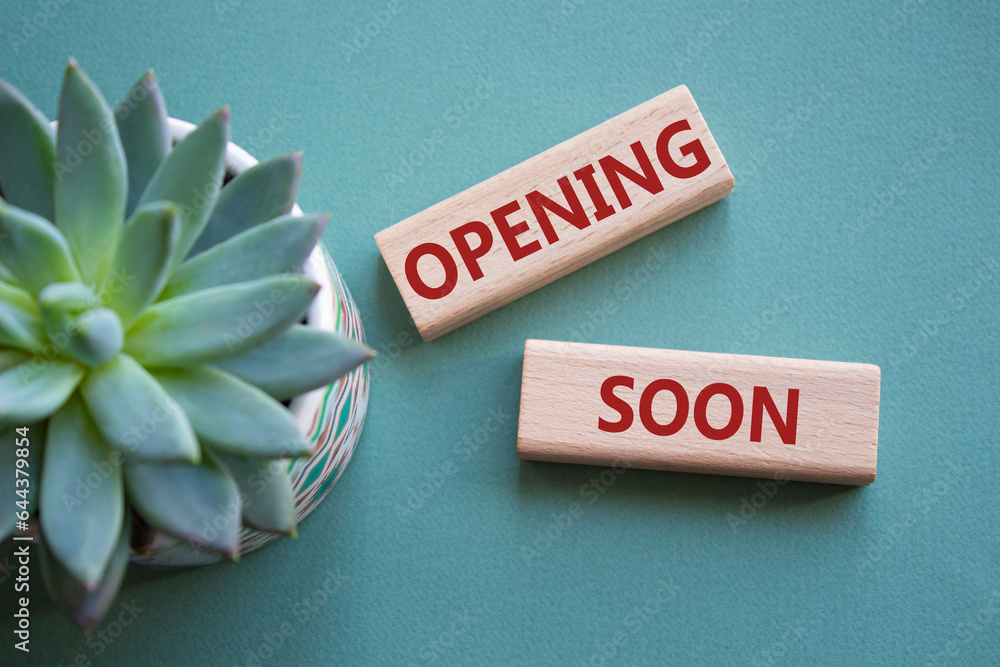 Opening soon symbol. Concept word Opening soon on wooden blocks ...