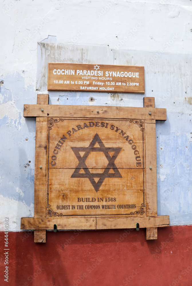 A wooden display board on the exterior wall of an old heritage Jew ...