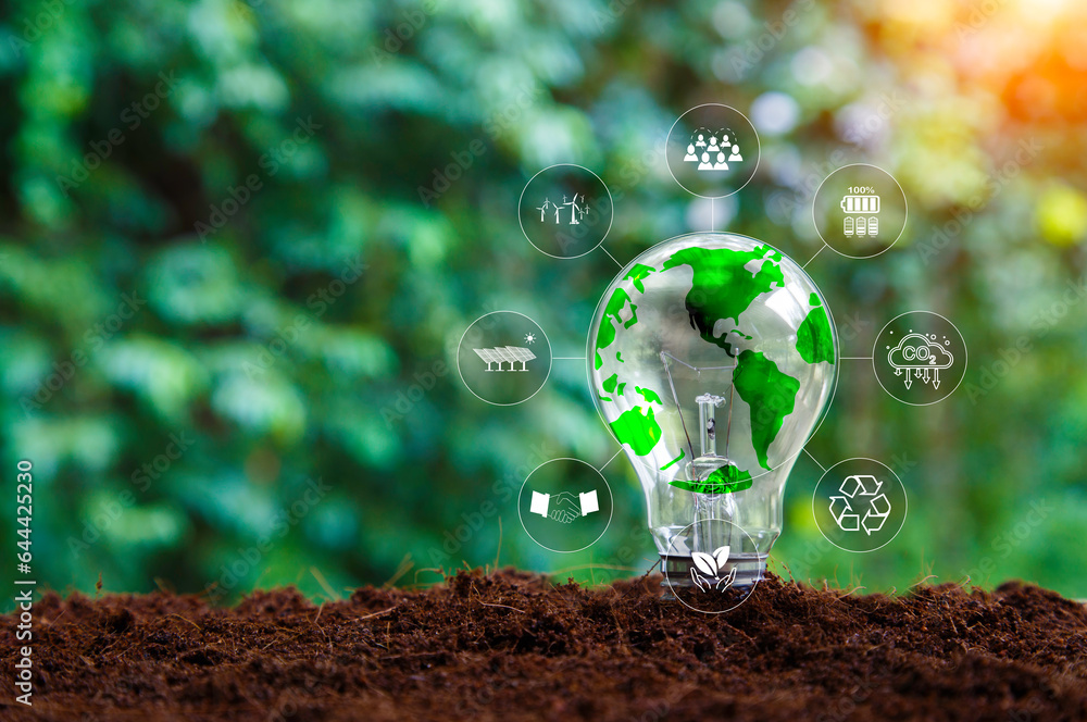 Renewable sustainable green energy icon around light bulb on green ...