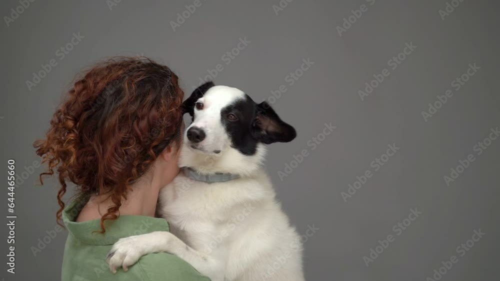 dog with woman with long curly hair holding hugging her calm sad face ...