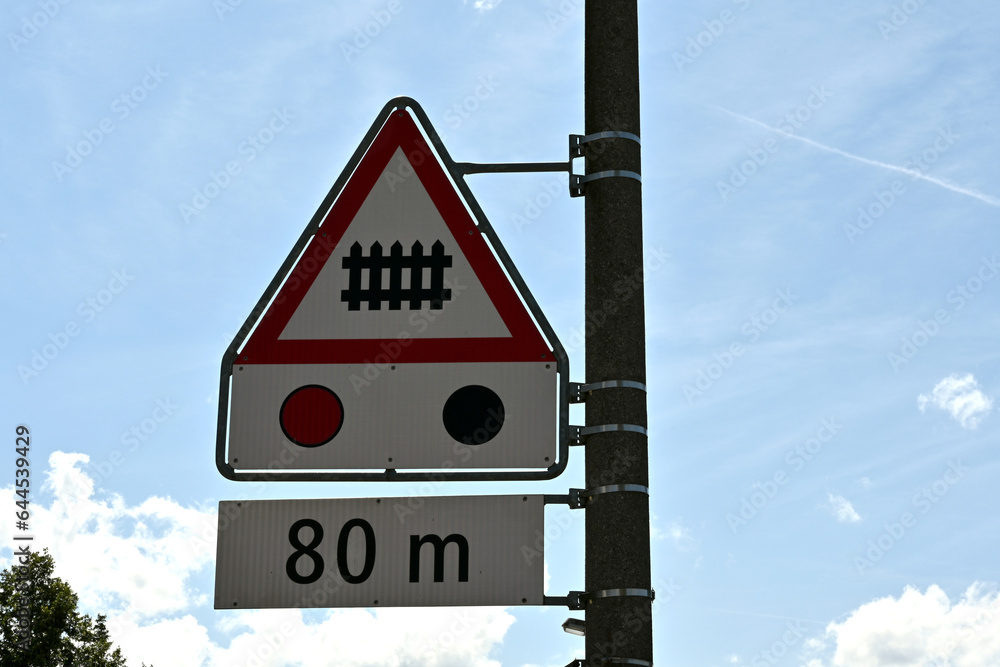 Three traffic signs arrange vertical are meaning railroad crossing ...