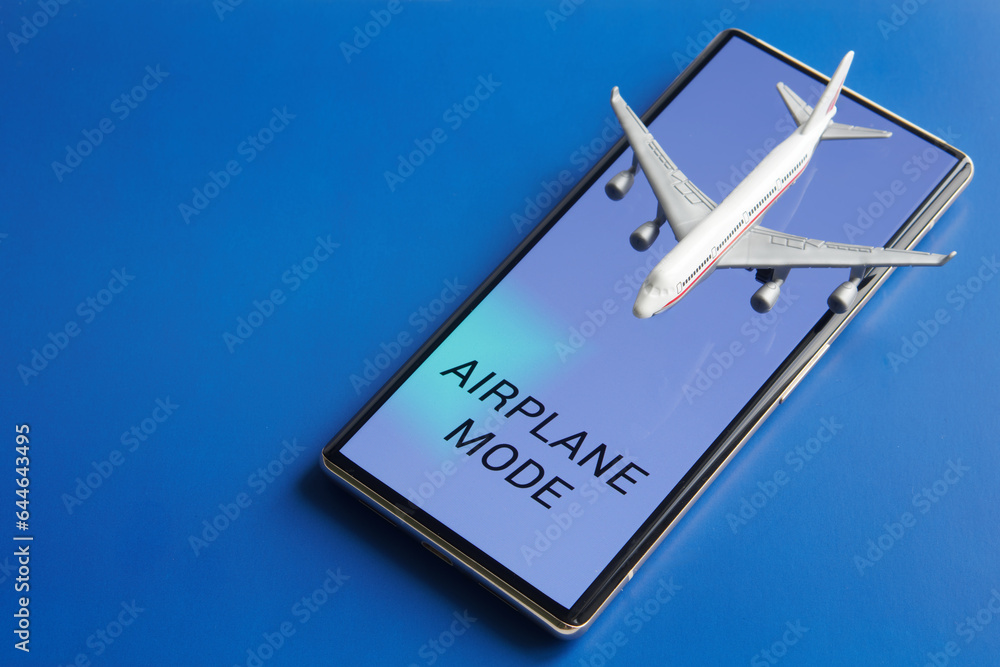 Mobile phone - smartphone with the inscription "Airplane mode" and toy ...