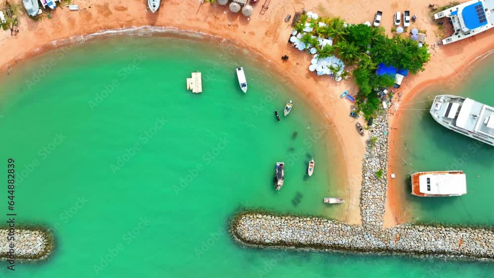 Breakwaters appear as extensive, often linear formations extending from ...