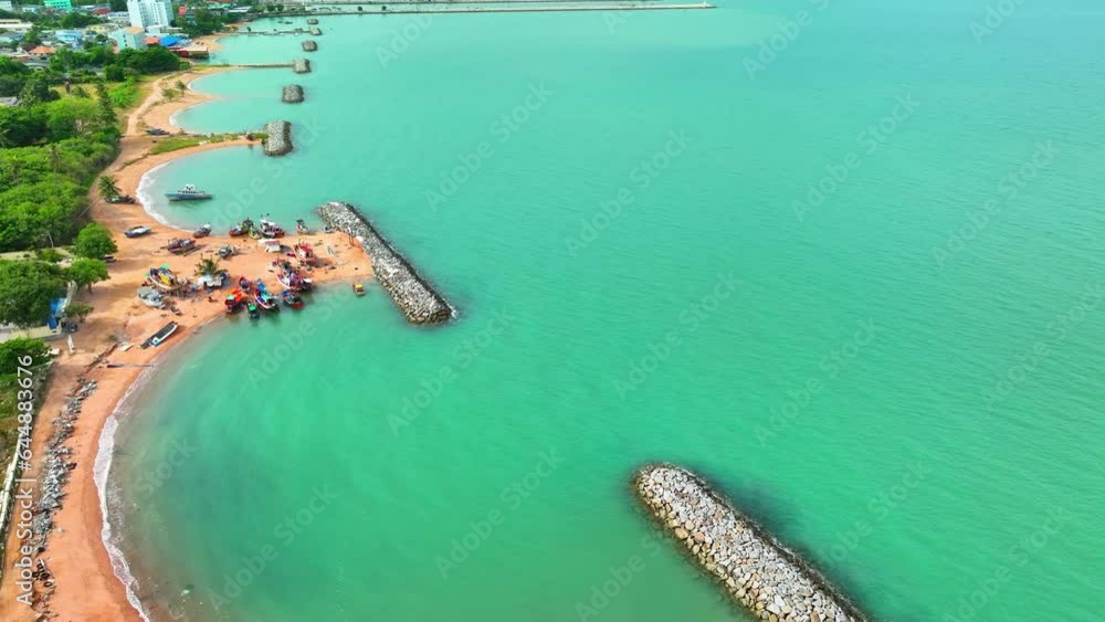 Breakwaters, crucial for coastal protection, seen from a drone's aerial ...