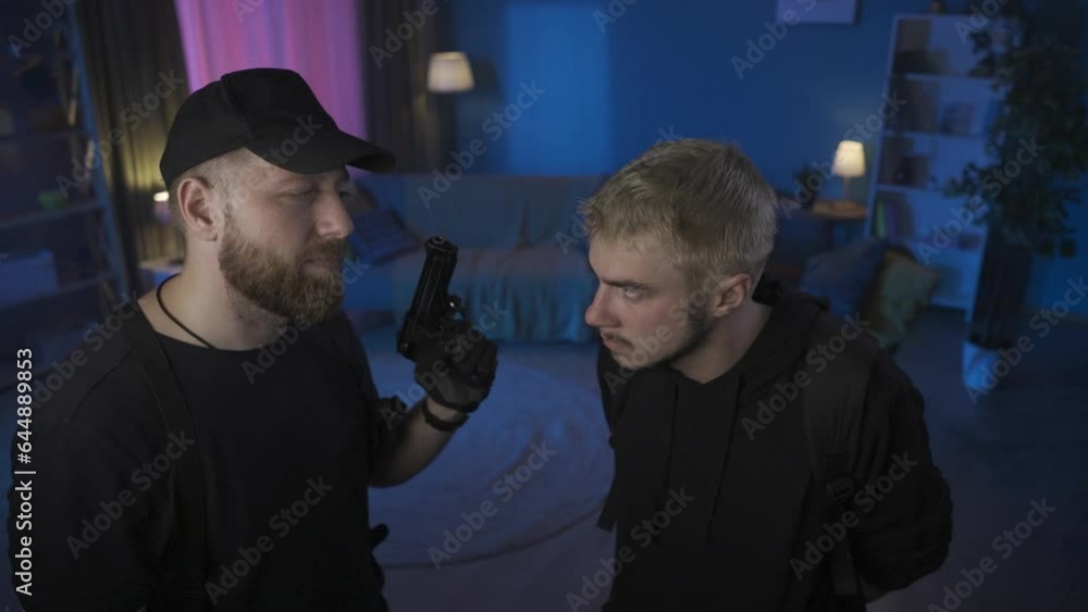 Video of a policeman, cop, looking at the camera, standing next to the ...