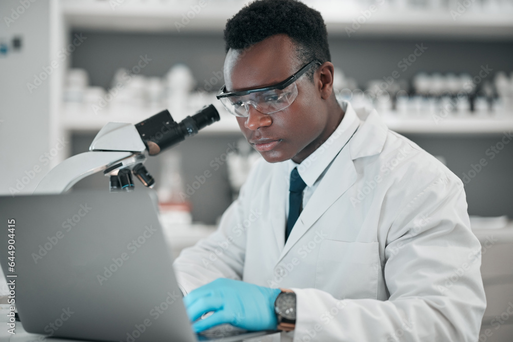 Microscope, laptop and black man with research, medical and typing with ...