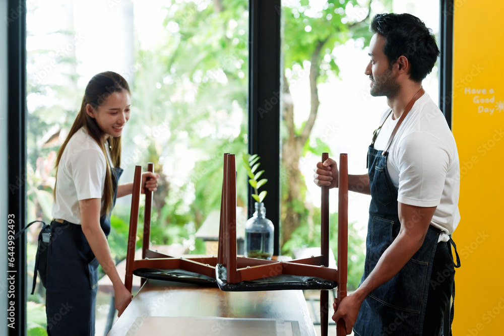Business couple owning cafe. Young Asian woman and man of different ...