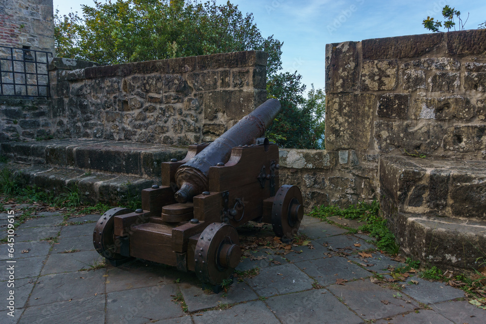 Antique cannon artillery defensive weapon at historic fort building ...