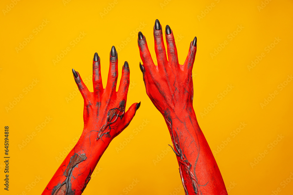 Creepy, red hands of a monster on a yellow background Stock Photo ...