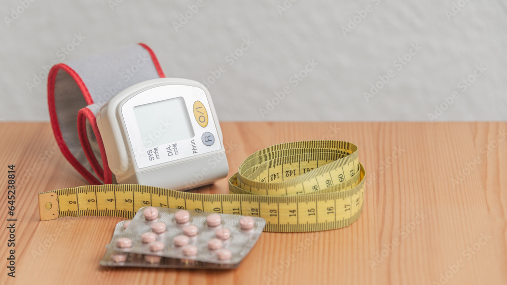 Small modern blood pressure measuring device and tape meter ruler to ...