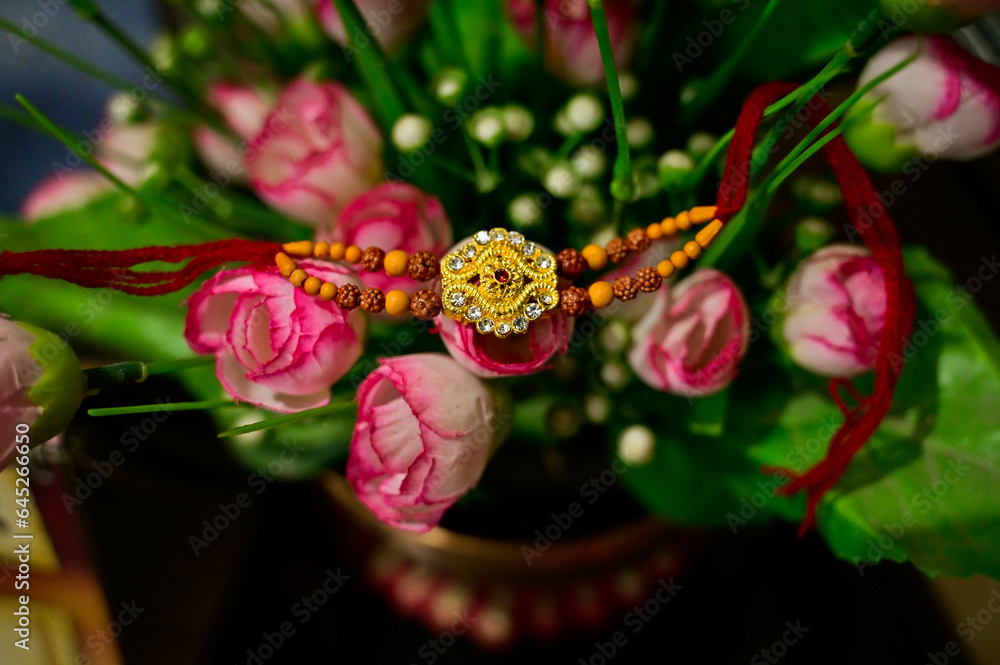 Lovely Rakhi on a flowers. Raksha Bandhan ceremony. brothers and ...