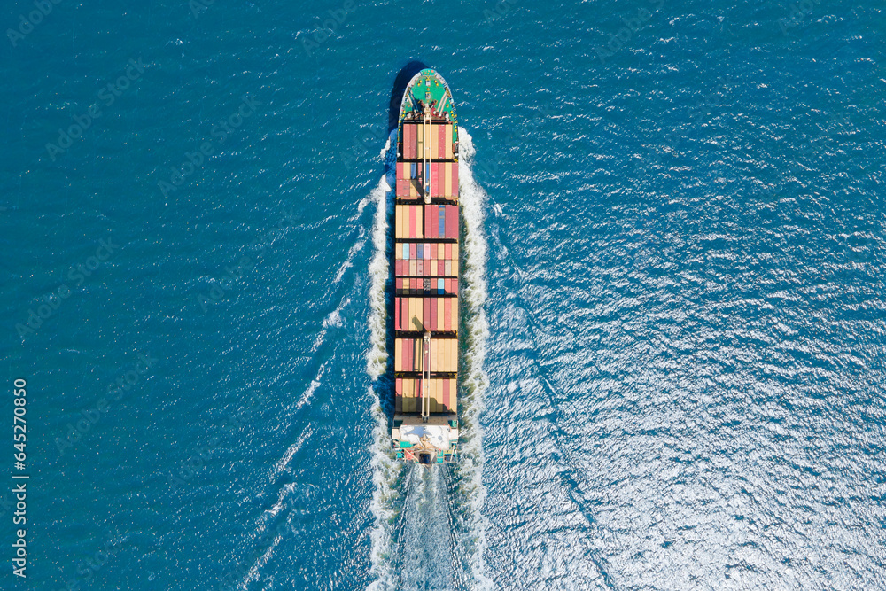 Loaded container ship cruising open ocean sea for logistics import ...