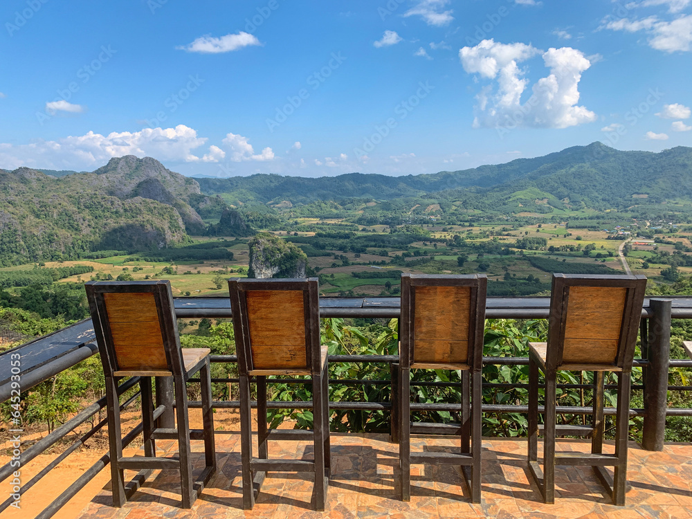 High bar stools on balcony with scenic mountain landscape at ...