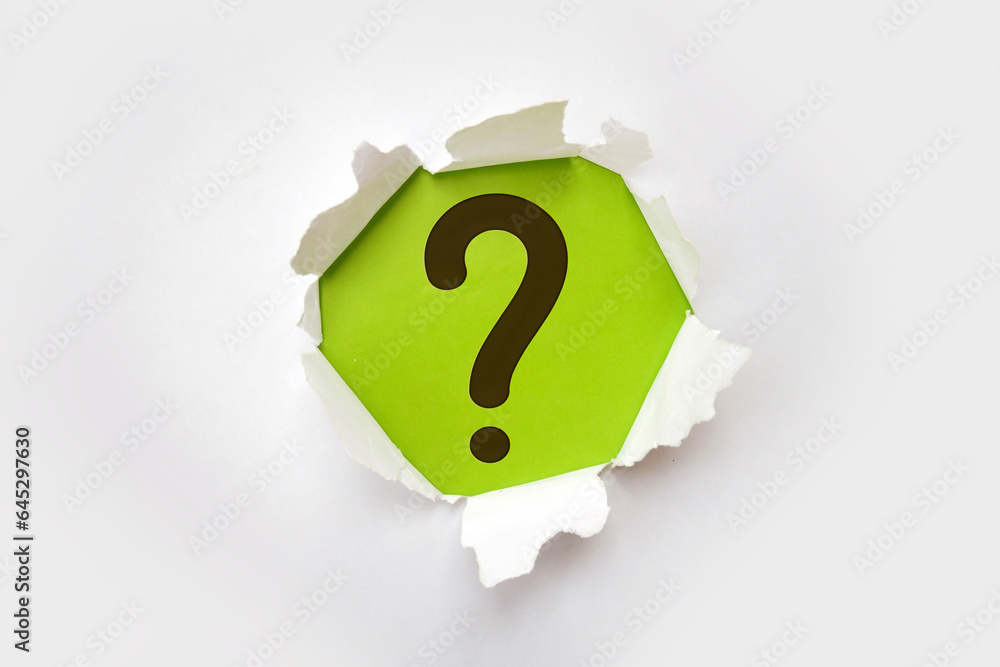 Torn out white paper with question mark symbol. White torn paper ...