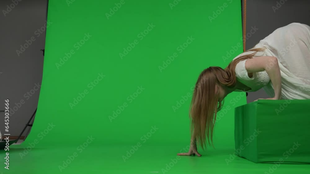 Full-size side view green screen chroma key video of a posessed female ...