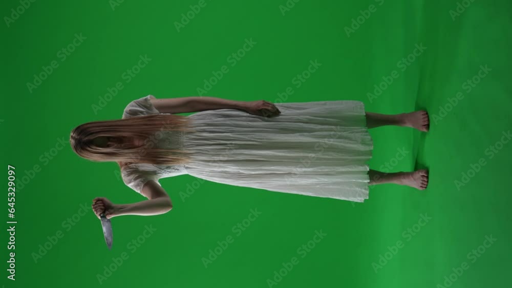 Full-size vertical green screen, chroma key video of a posessed female ...