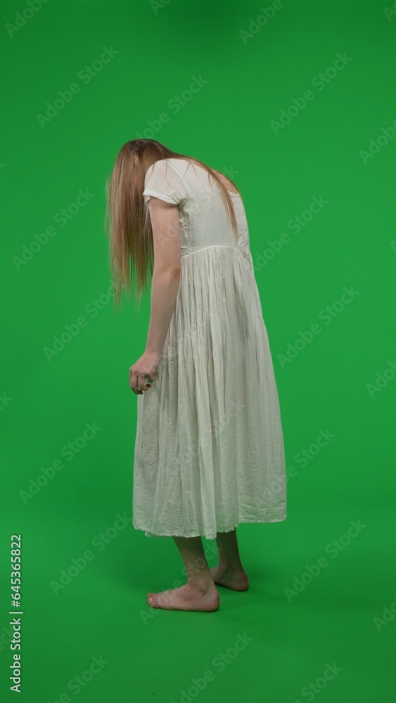 Full-size half turn vertical green screen, chroma key shot of a ...