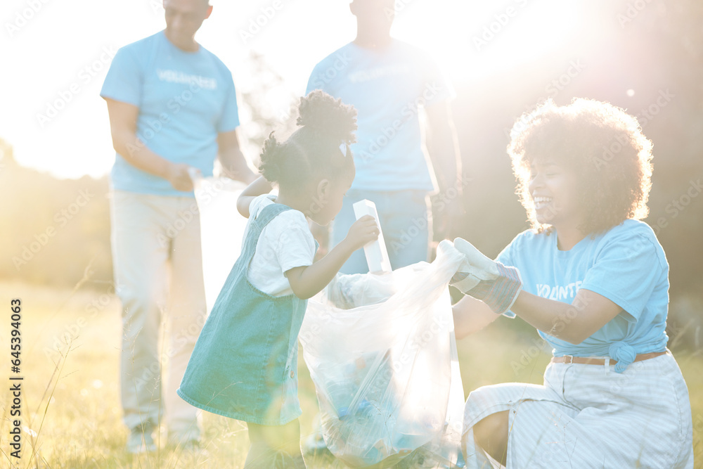 Nature activist, volunteering family and child cleaning garbage ...