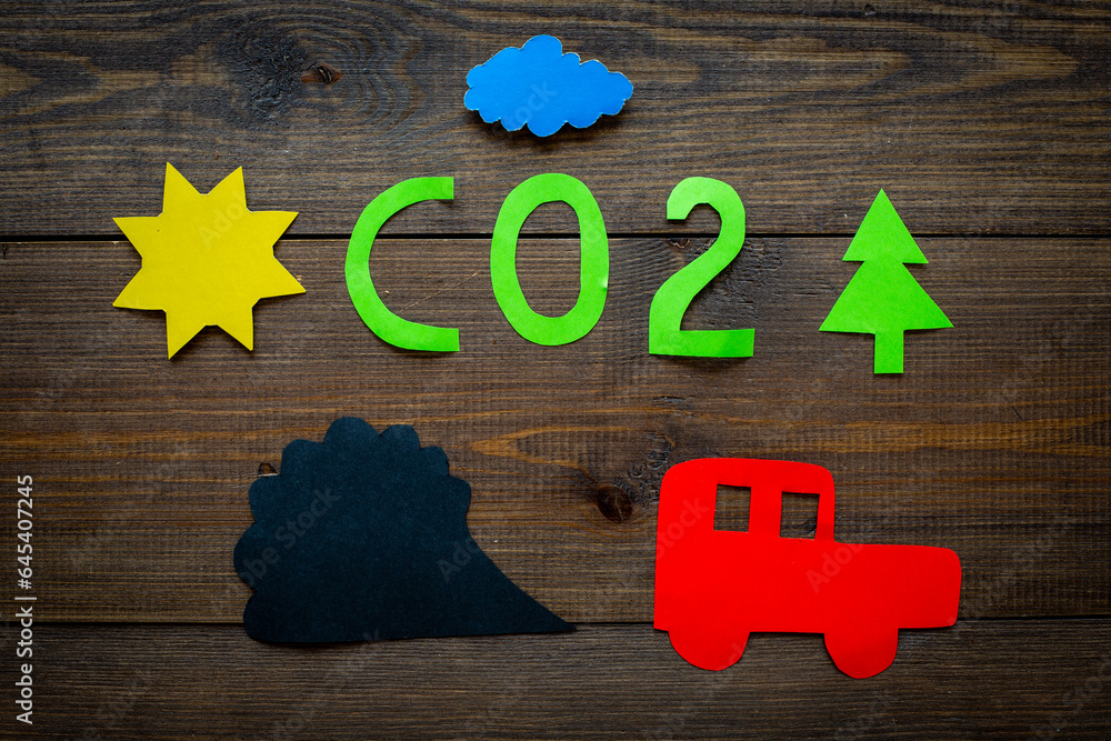 CO2 carbone dioxide control concept. Paper car and traffic fumes. Kids ...