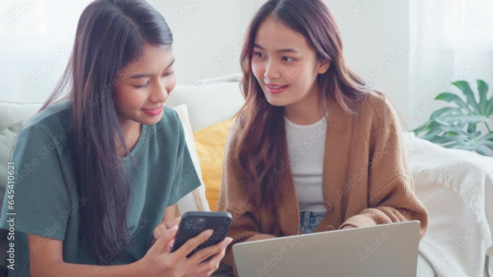 Two woman communicate with their friends and classmates via video link ...