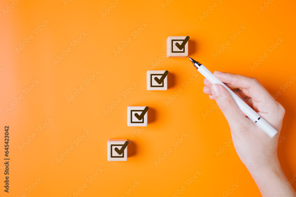 Wooden blocks of correct icons for checklist target goal business ...