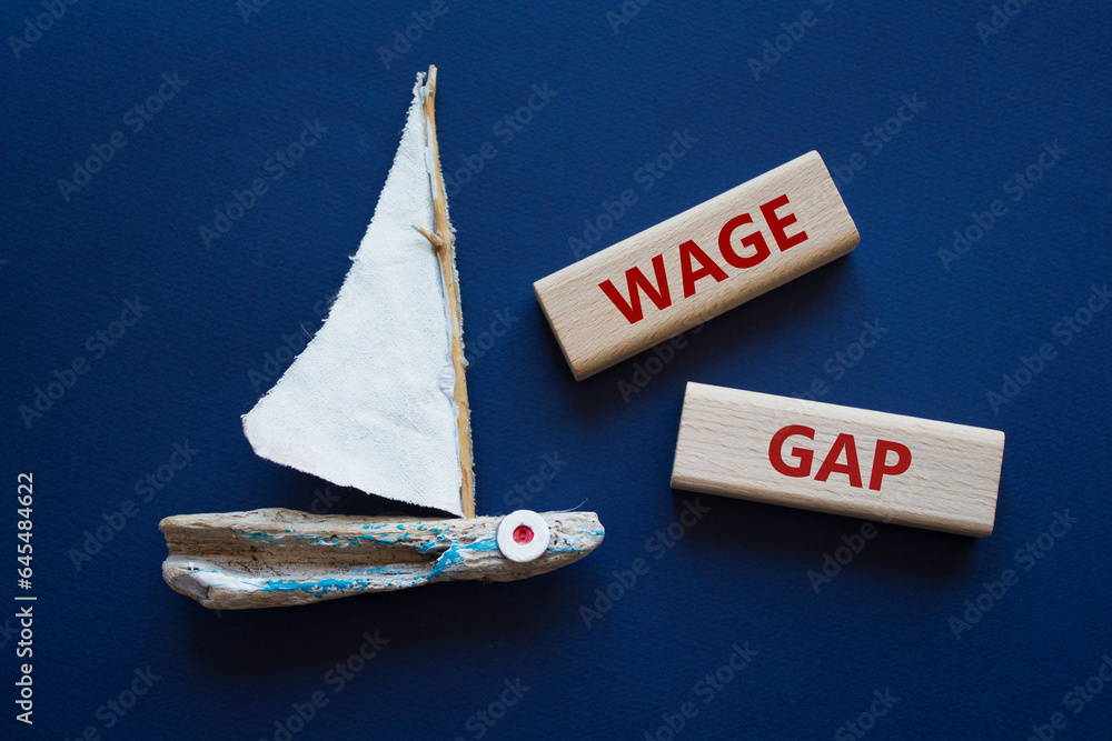 Wage Gap symbol. Concept words Wage Gap on wooden blocks. Beautiful ...