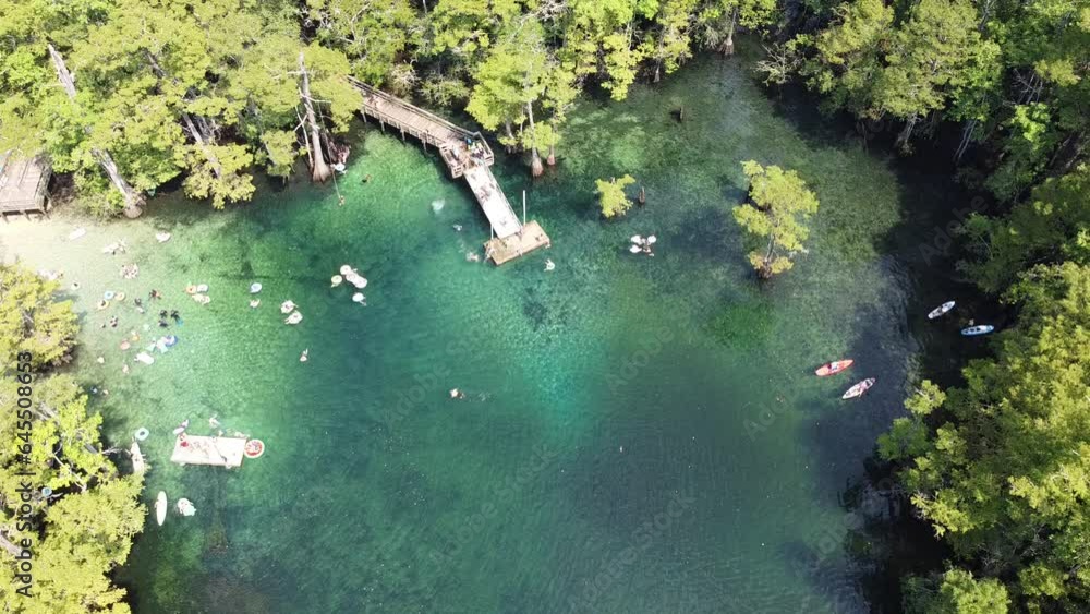 People enjoy swimming, jumping off deck to magnitude turquoise blue ...