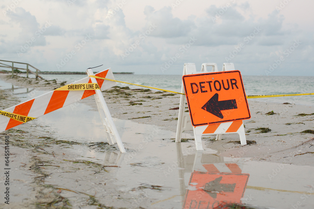 Beach closed barricades on closed beach after hurricane. Orange and ...